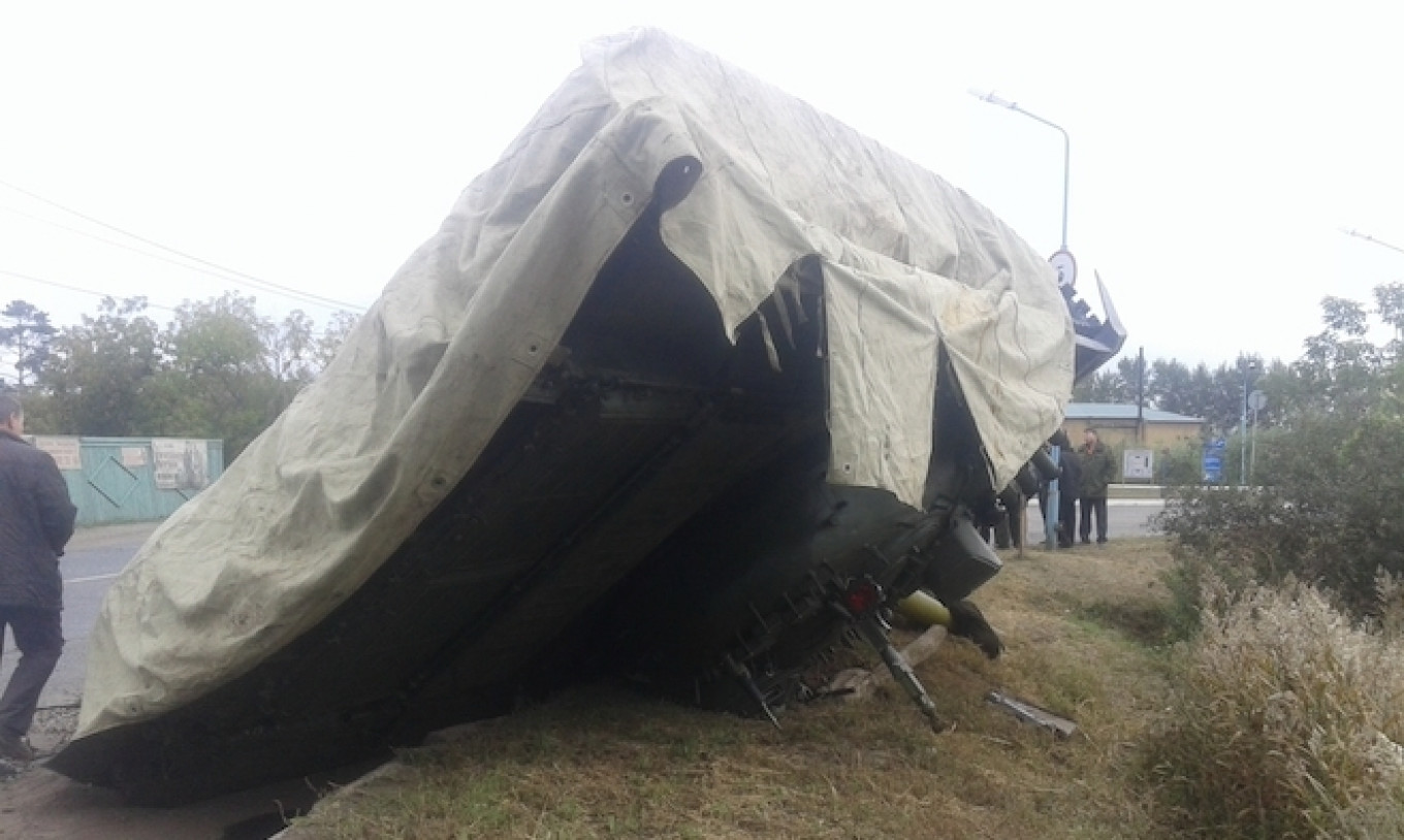 Tank Falls Off Truck in Middle of Siberian City