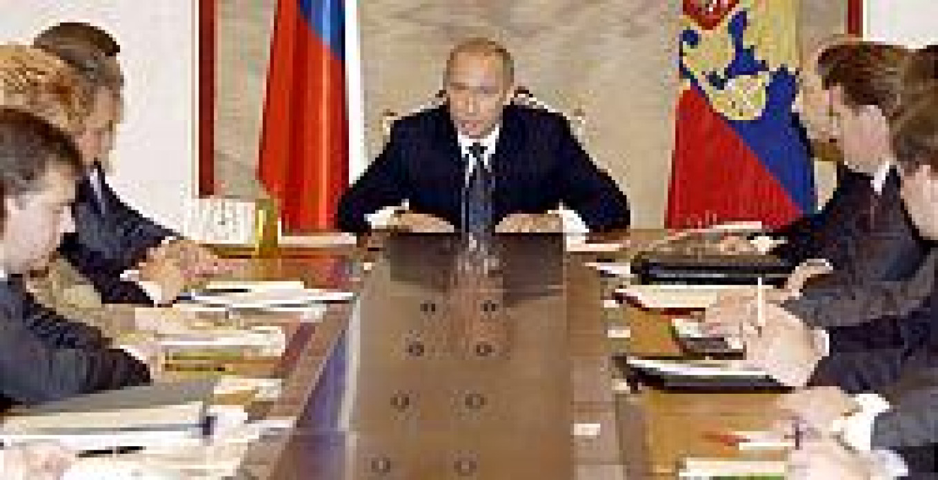 Putin Defends Attacks on Yukos