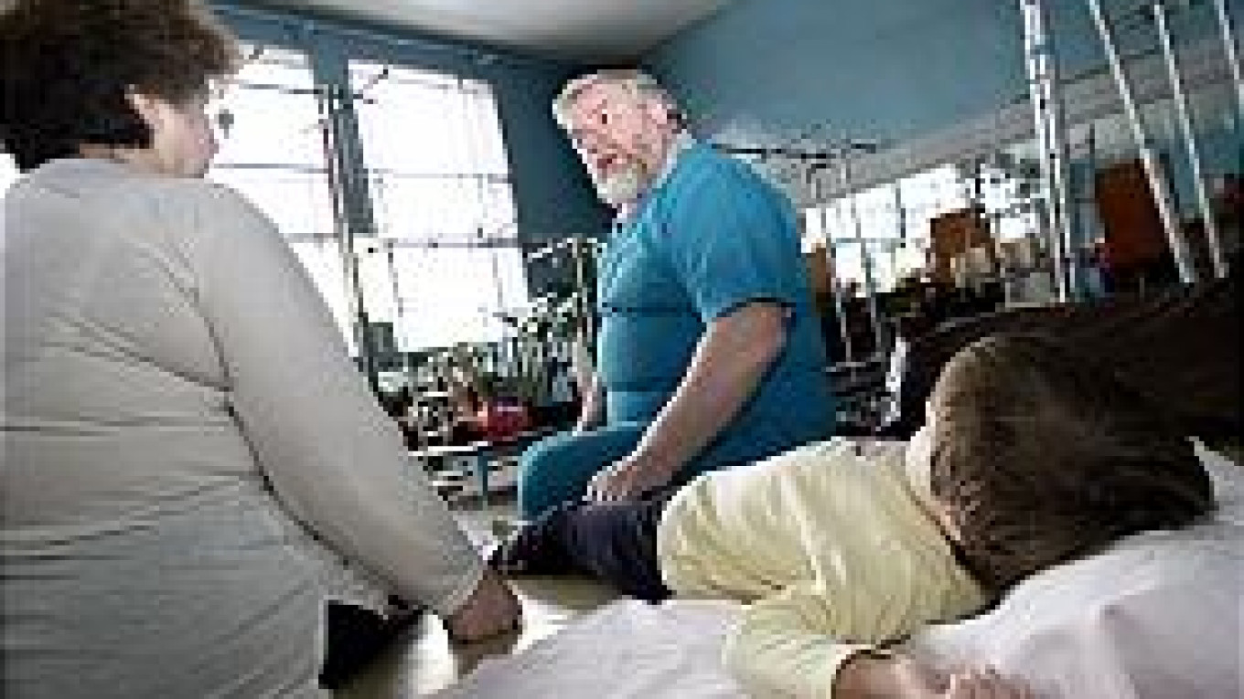 Strongman Sells Determination in Spinal Clinic