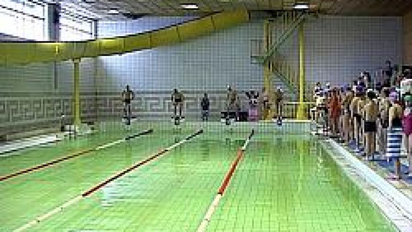 Toll in Pool Collapse Rises to 14